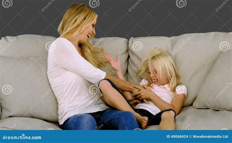 Mother Tickling Her Daughter On Sofa Stock Footage Video Of Filming