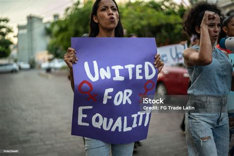 Young Protester Woman Holding Sign About Gender Equality On