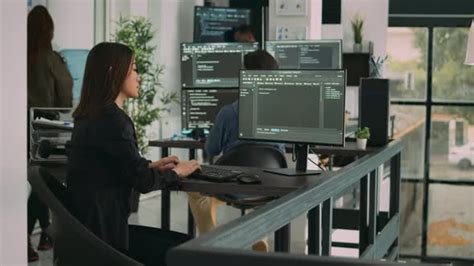 Asian Software Engineer Working With User Interface On Computer Screen