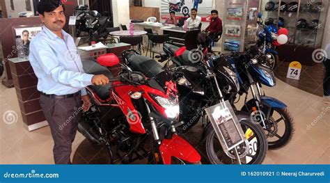 Honda Bike Motorcycle Showroom Attender Presenting Latest Bike Model