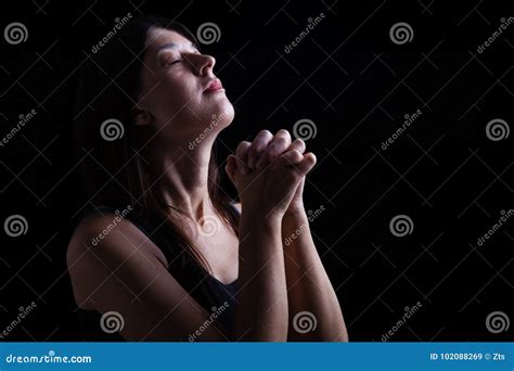 Faithful Woman Praying Hands Folded In Worship To God Royalty Free