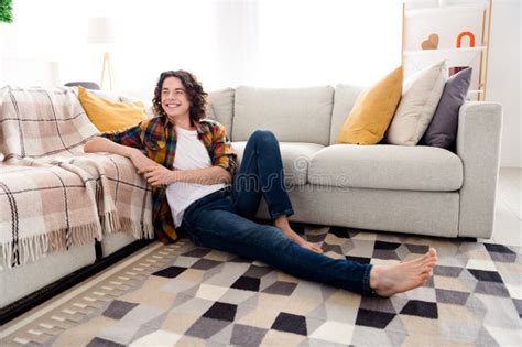 Photo Of Positive Good Mood Guy Wear Plaid Shirt Sitting Floor Enjoying