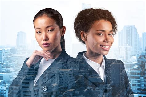 Premium Photo Two Young Attractive Businesswoman In Suits Dreaming