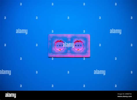 Red Illuminated Socket To Symbolise Power Consumption And Electrical