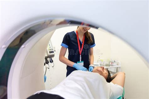 Radiologist With A Female Patient In The Room Of Computed Tomography
