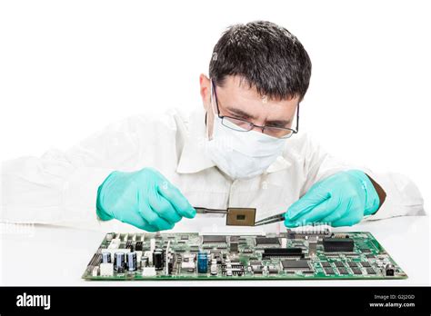 Holding Microchip On Electronic Circuit Board With Tweezers On White Background Stock Photo Alamy