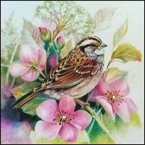 A Bird Sitting On Top Of Pink Flowers