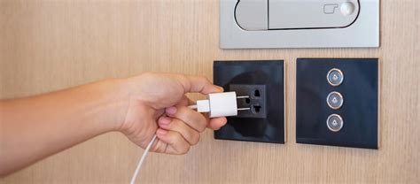 premium photo closeup finger unplugging or plugging of electricity