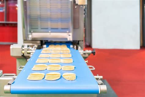 Close Up Bologna Sliced Plate On Conveyor Of Automatic Slicer Machine