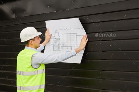 Engineer Working With Blueprint Stock Photo By AnnaStills PhotoDune