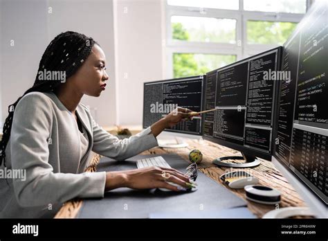 African American Coder Using Computer At Desk Stock Photo Alamy