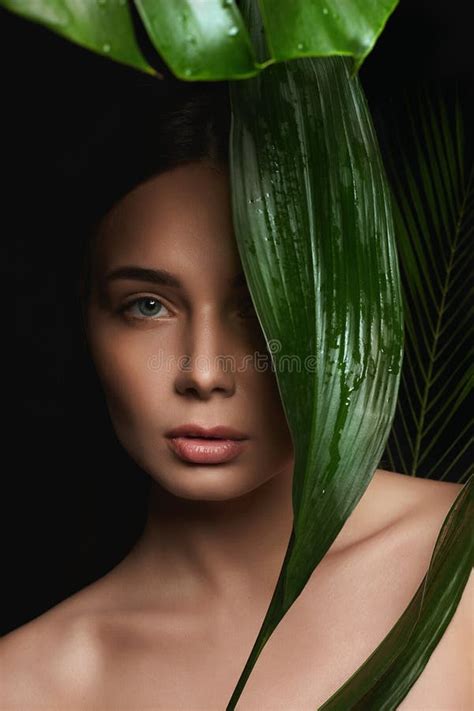 Beauty Portrait Of Brunette Girl In Palm Leaves Beautiful Young Woman
