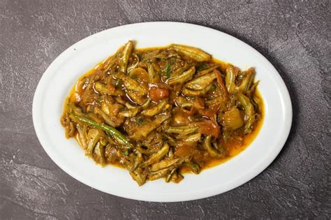 Premium Photo Mola Fish Bhuna Korma Curry Served In Dish Isolated On