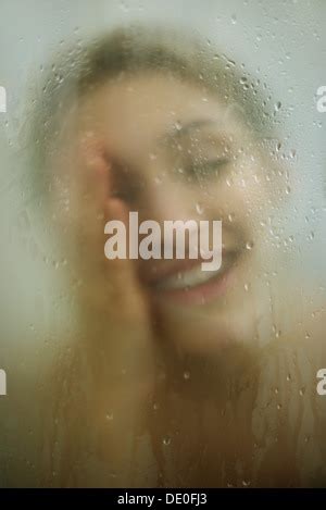 Woman In The Shower Covering Her Breasts With Her Hands While All Soapy