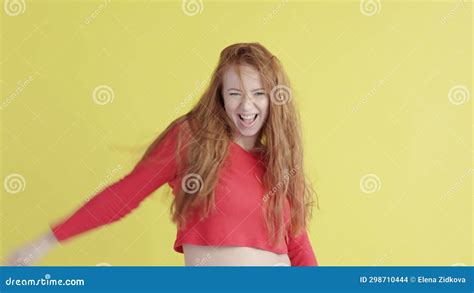 Funny Cheerful Female Sexually Shakes Her Hair And Laughs In Good Mood