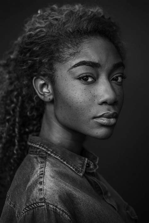 A Black And White Photo Of A Woman With Freckled Hair
