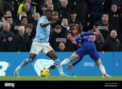 Jeremy Doku Of Manchester City Battles Cole Palmer Of Chelsea