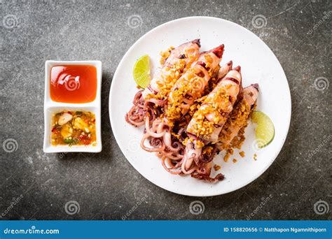 Fried Squid With Garlic Stock Photo Image Of Closeup 158820656