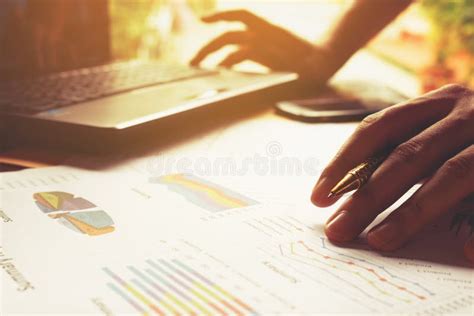 Man Calculate Cost And Expenses And Using Laptop For Search Data Stock