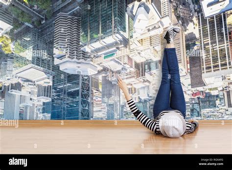 Student Girl Lying On Floor With Legs Raised Up Mixed Media Stock