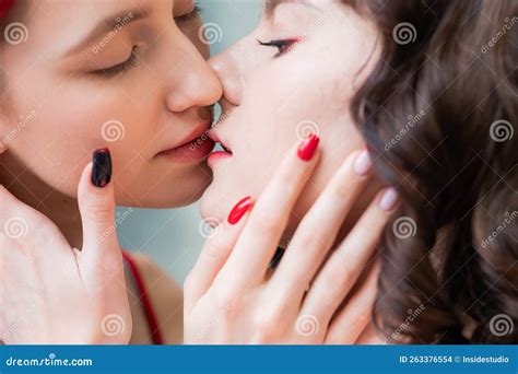 Close Up Portrait Of Kissing Caucasian Women Same Sex Love Stock