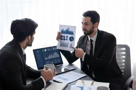 Busy Analyst Team In Office Discuss Data Analysis And Marketing