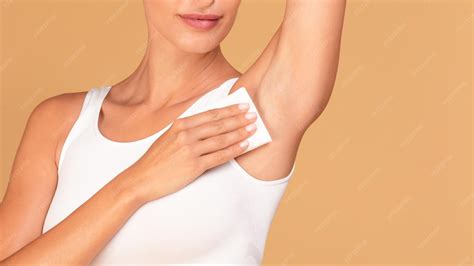 Premium Photo Hyperhidrosis Concept Closeup Of Young Lady Wiping Her