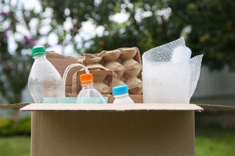 Recycling Different Garbage In Cardboard Box Outdoors Stock Image