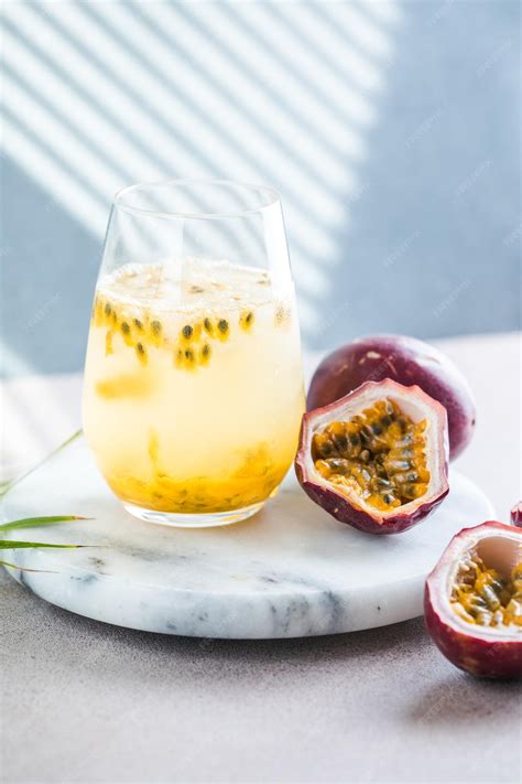 Premium Photo Pure Passion Alcoholic Cocktail With Syrup Lime Orange