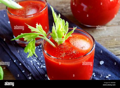Tomato Juice With Celery Spices Salt And Ice In Portion Glasses