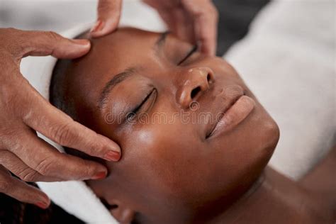 Black Woman Relax Face And Luxury Spa Massage Of A Young Female Ready