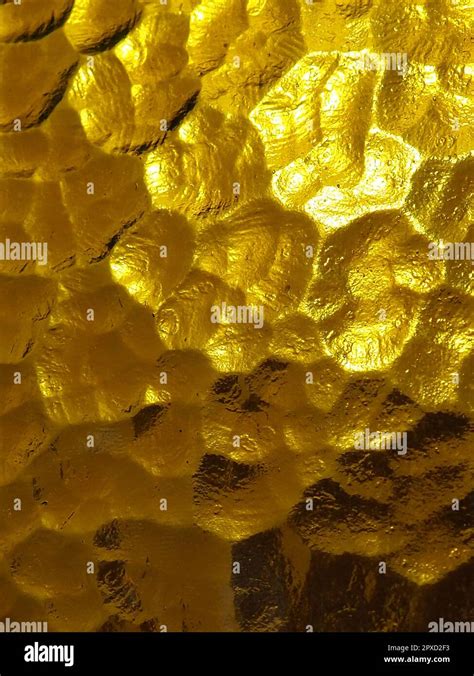 Golden Yellow Corrugated Glass With A Light And Dark Background Reflections Of Light