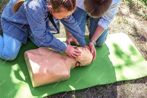 Premium Photo First Aid Instruction On A Mannequin A Doctor Teaches A