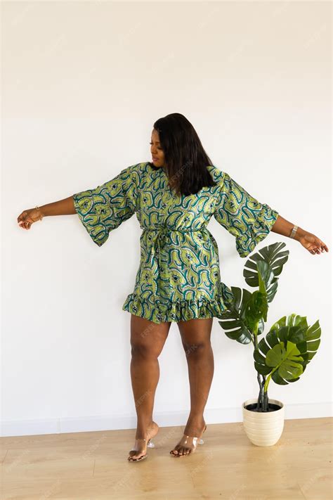 Premium Photo Smiling Confident African American Young Woman Wears Stylish Dress Standing Over