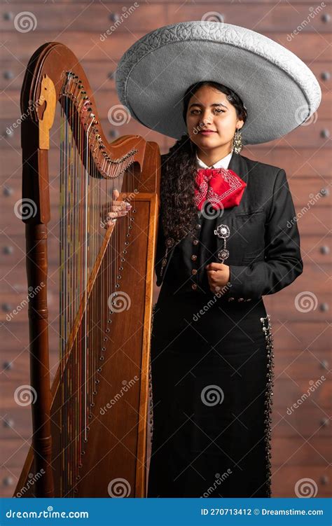 Female Mexican Mariachi Woman Smiling Using A Traditional Mariachi Girl