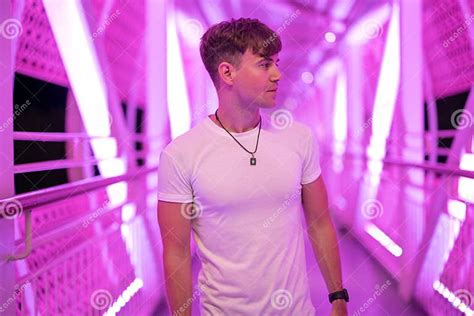 Side View Portrait Of Attractive Handsome Young Man Wearing White Shirt