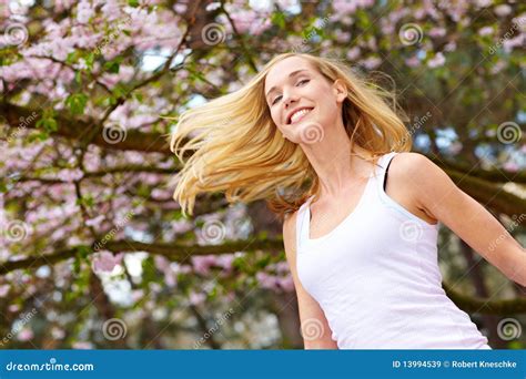 Woman Jumping Under Cherry Tree Stock Image Image Of Leisure Dancing