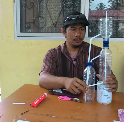 TIK SMANSA TELUKDALAM EKSPERIMEN POMPA AIR TANPA LISTRIK SEDERHANA