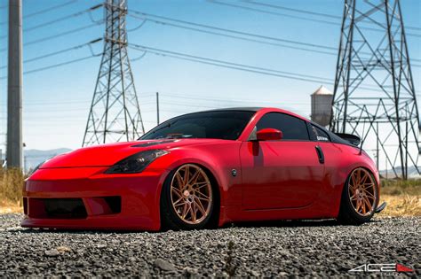 Slammed Nissan 350z With Black Headlights And Bronze Ace Wheels Carid
