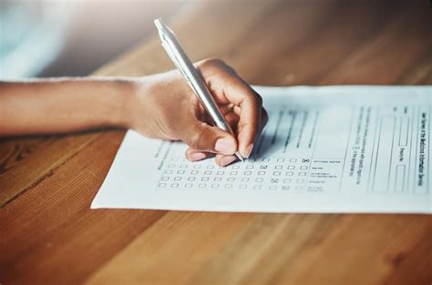 Premium Photo Checklist Hand And Pen Writing On Document For Legal