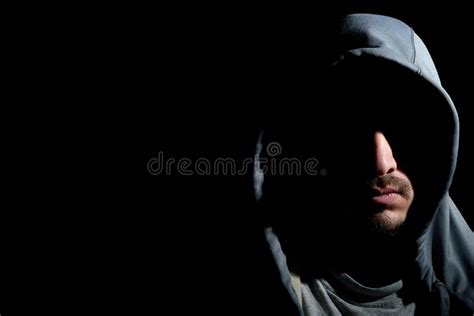 Horizontal Portrait Shot Of Mysterious Young Bearded Hooded Man Stock