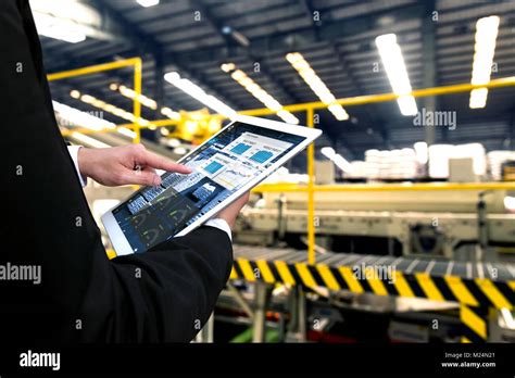 Engineer Hand Using Tablet With Machine Real Time Monitoring System Software Automation Robot