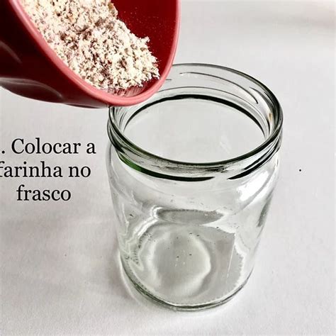 A Red Measuring Cup Filled With Flour Next To A Glass Jar Full Of White
