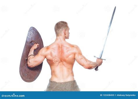 Bodybuilder Man Posing With A Sword And Shield Isolated On White