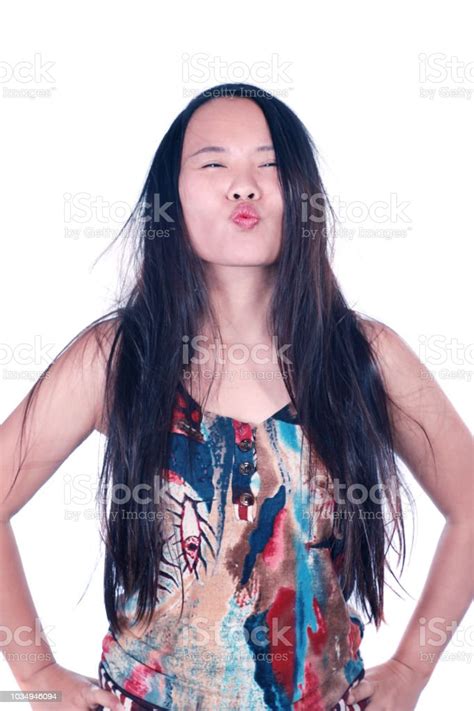 Portrait Of Asian Woman Making Face With Long Black Messy Hair Stock