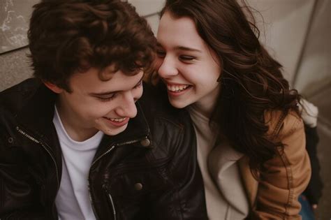 Joyful Young Couple Embracing And Laughing Together Premium Ai