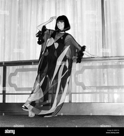 Model Wearing A Dress With See Through Garment On Top During A Japanese
