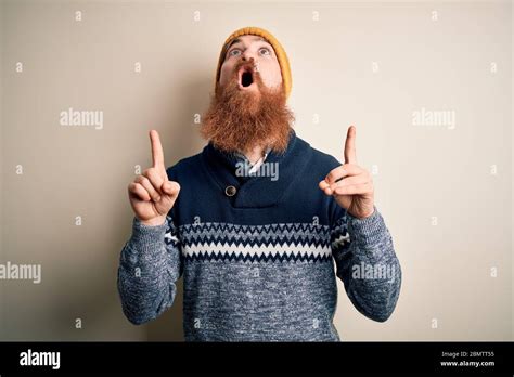 Handsome Irish Redhead Man With Beard Wearing Winter Sweater And Wool