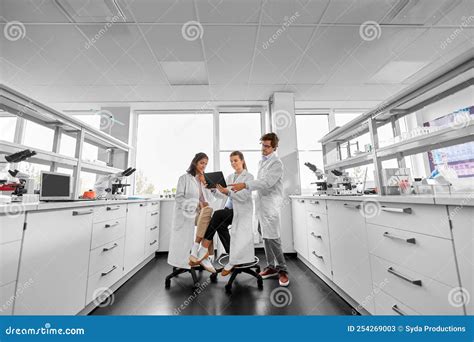 Scientists With Tablet Pc Working In Laboratory Stock Image Image Of Microbiology Scientist