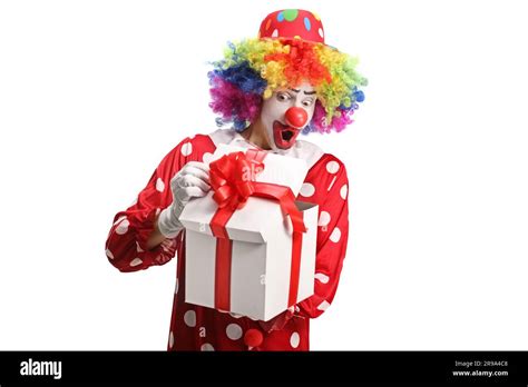 Clown Peeking At A Present Box Isolated On White Background Stock Photo Alamy